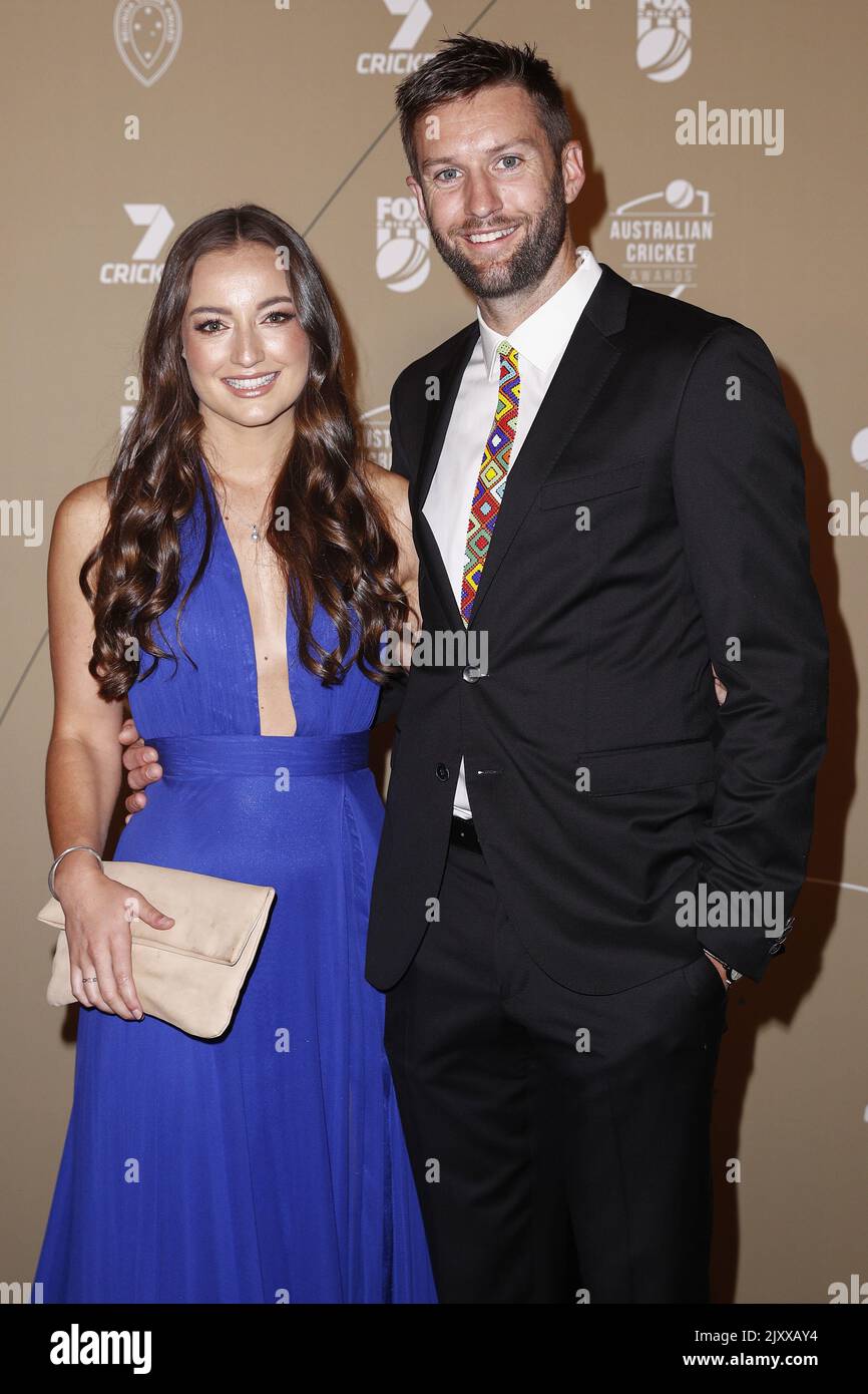 Andrew Tye and Bonnie Raynor pose for a photograph on arrival for the ...