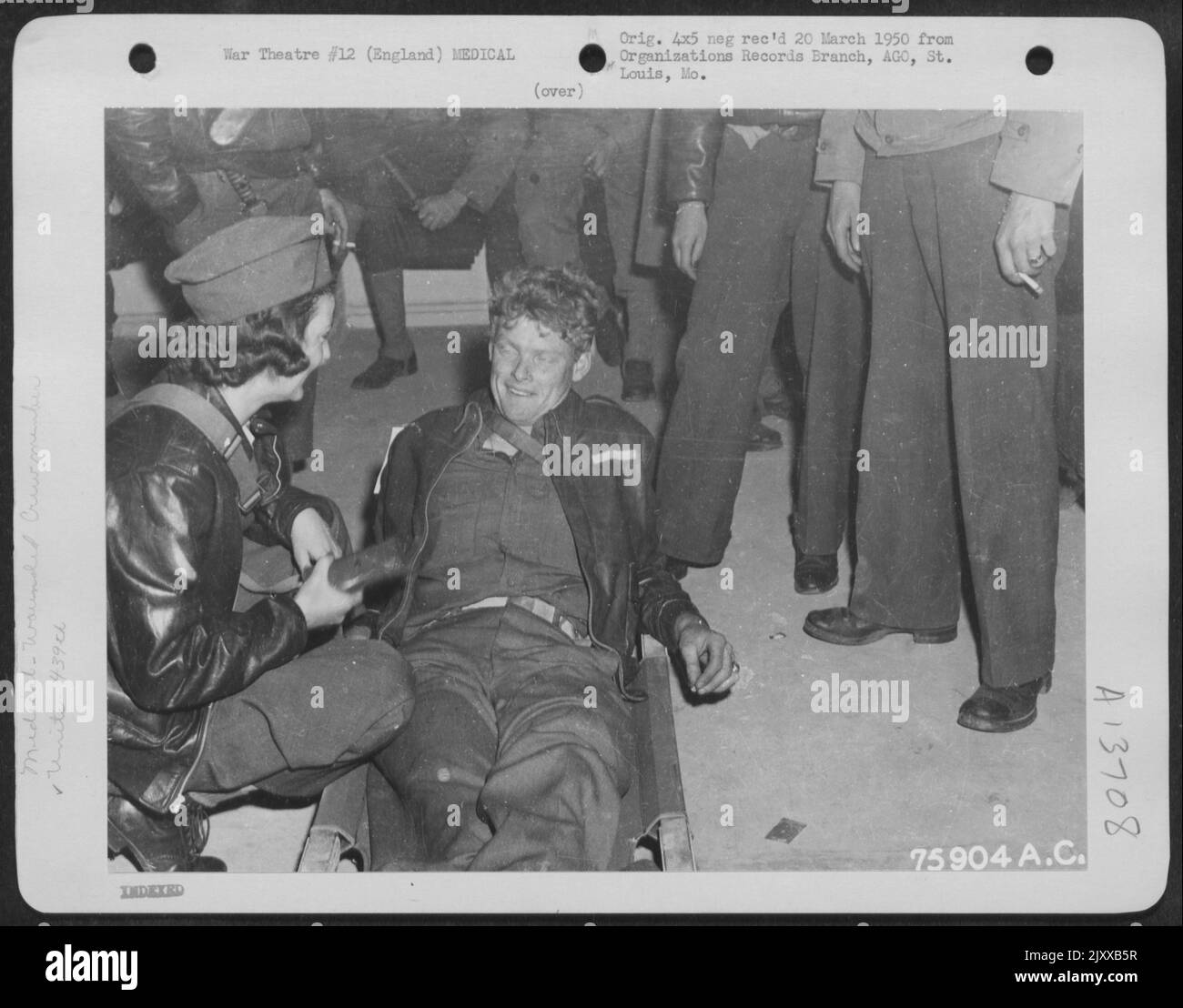 A Flight Nurse Talks To A Wounded Crew Member Of The 439Th Troop ...