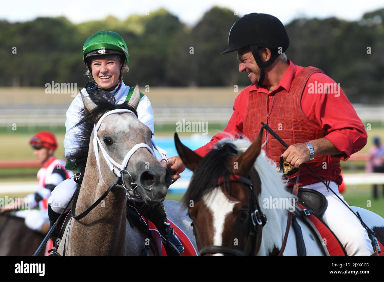 Jockey Kayla Crowther (left) rides Terbium back to scale after winning ...