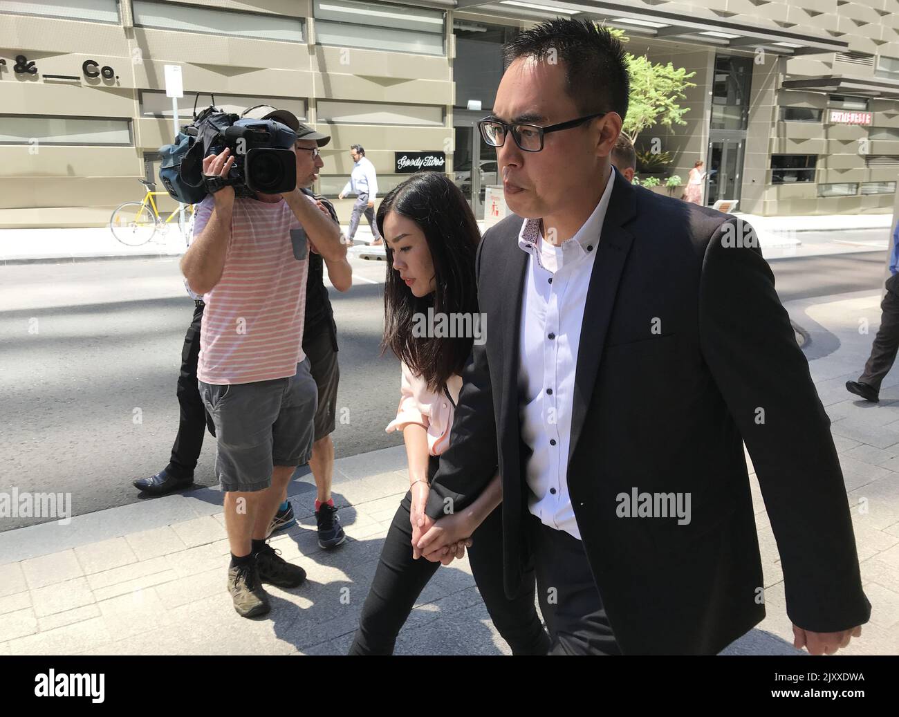Andrew Doan (right) and fiance Wendy Wang leave the District Court of ...