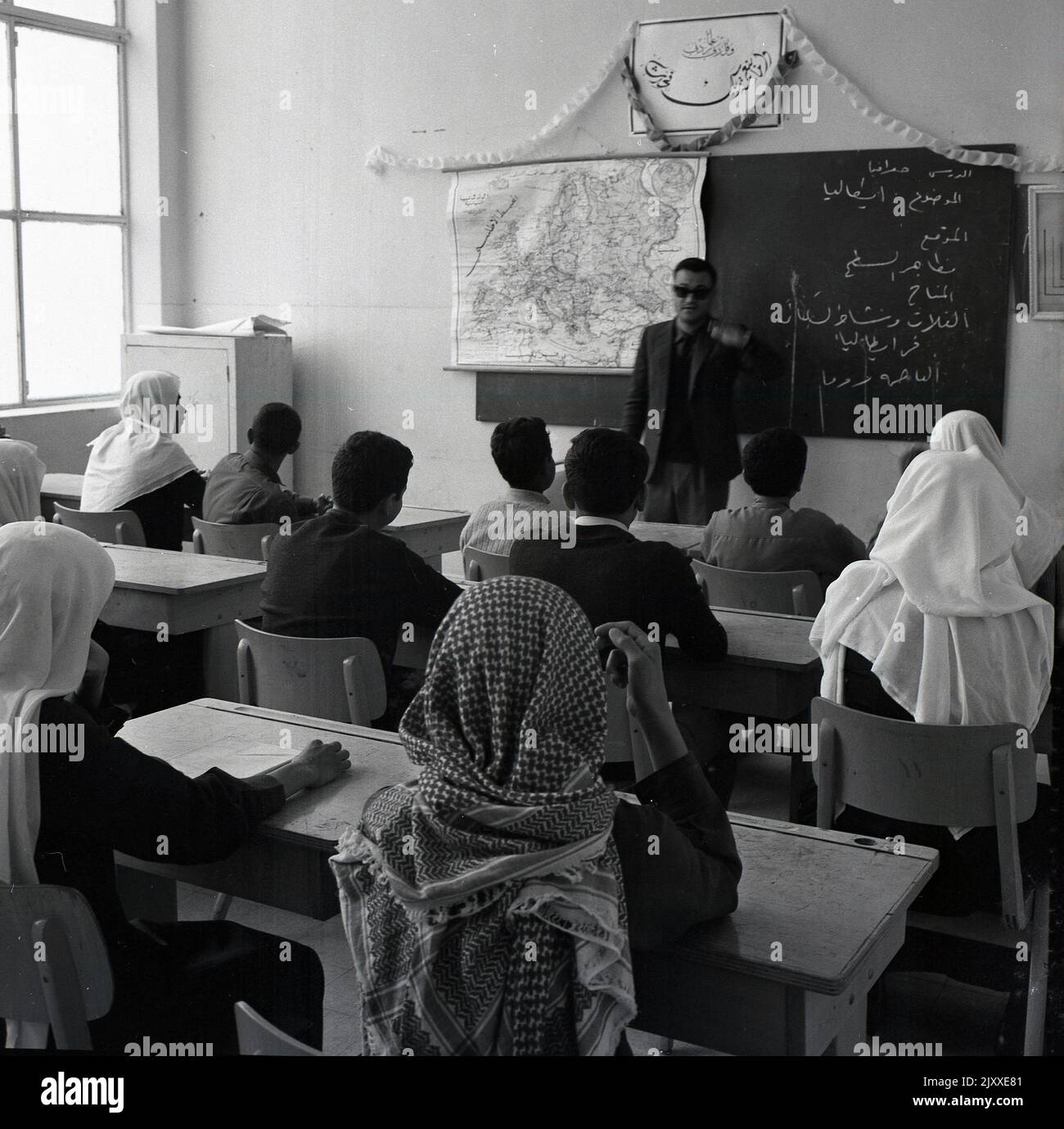 1960s, historical, education, arab boys sitting at wooden desks in a ...