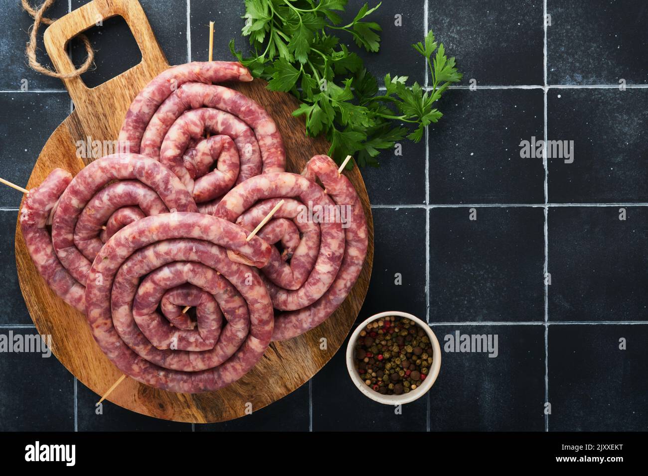 Raw spiral pork sausages. Fresh pork sausages tasty twisted spiral for ...