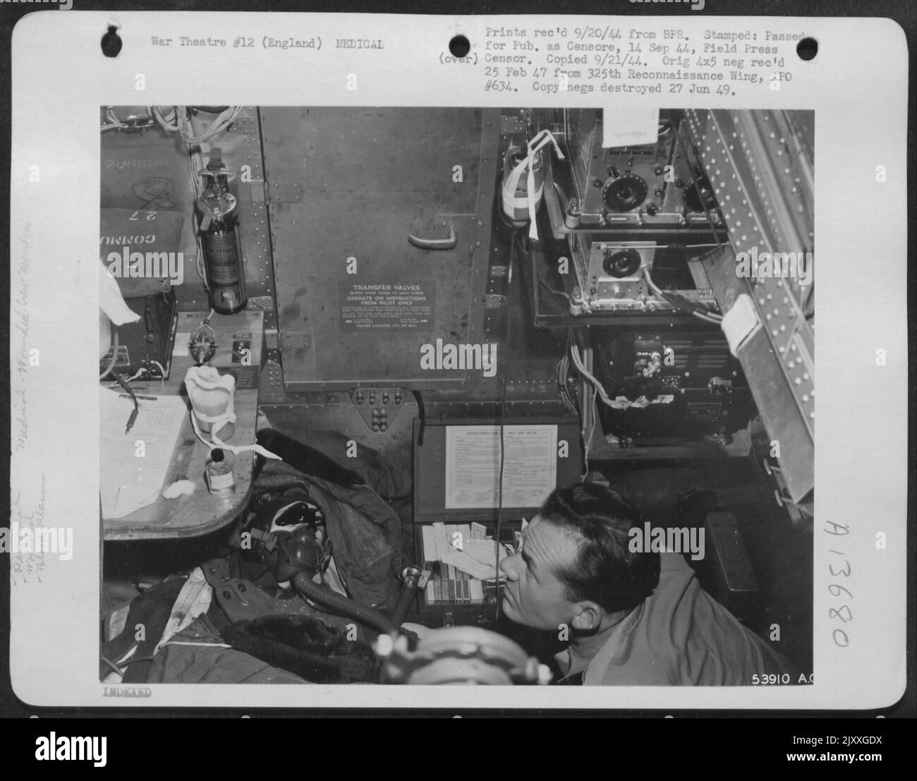 ENGLAND-In the narrow confines of a Boeing B-17 Flying ofrtress radio ...