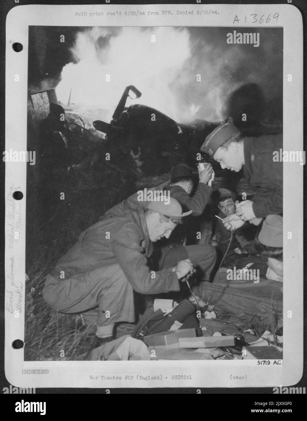 A life saved! A medical team gives blood plasma to an injured gunner ...