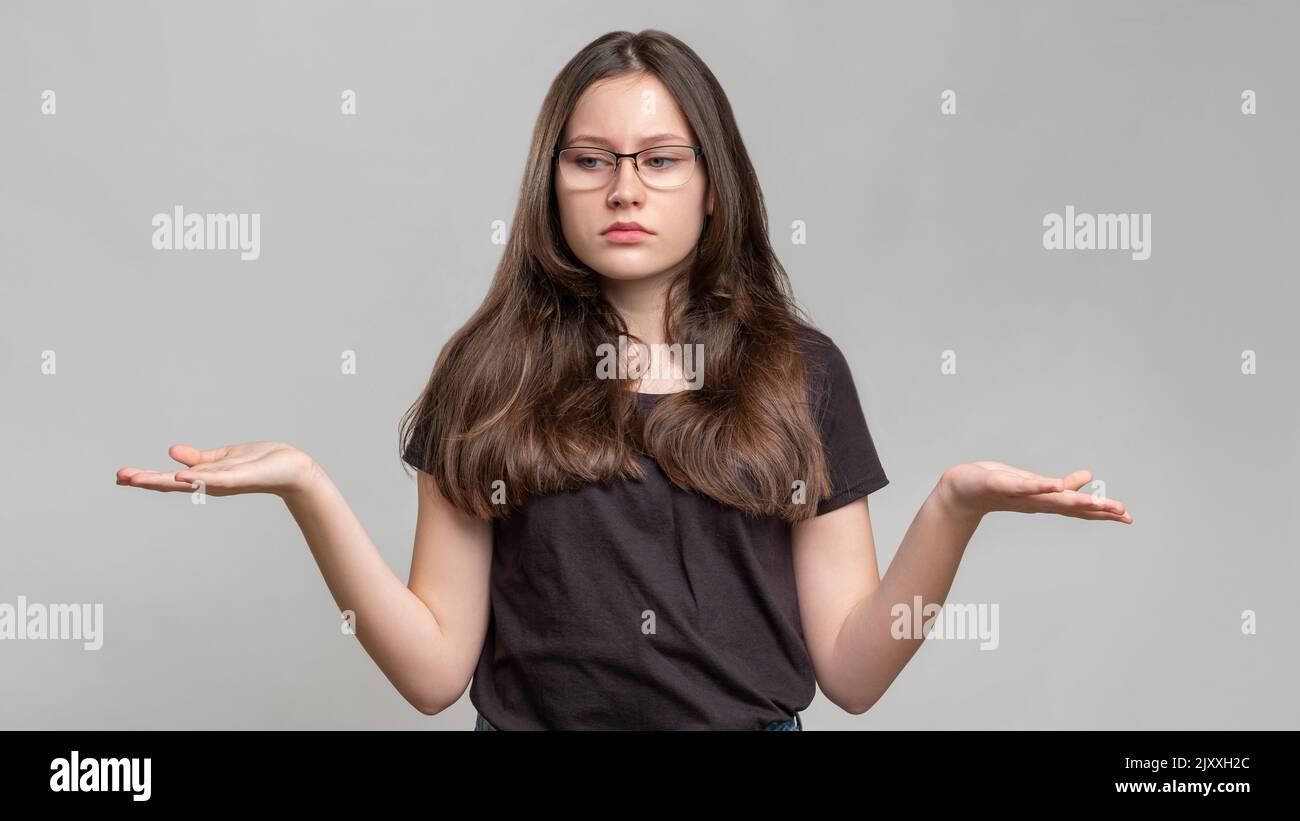 clueless woman portrait no idea overwhelmed shrug Stock Photo - Alamy