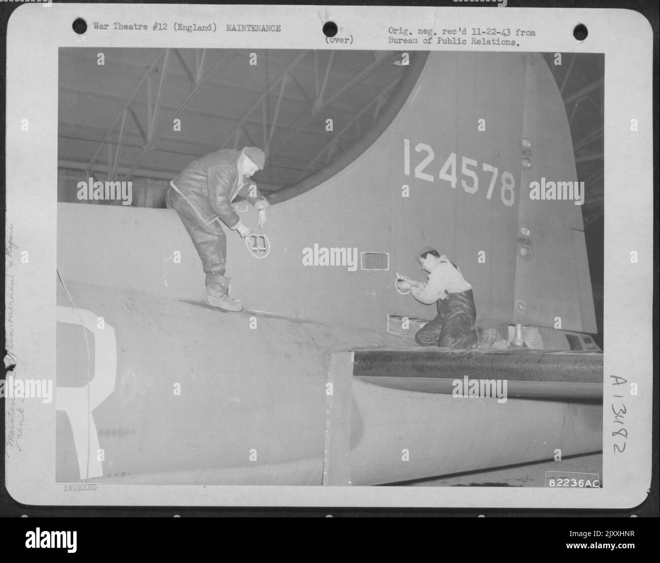 8Th Bomber Command Ground Crew Members Study And Repair Flak Damaged ...