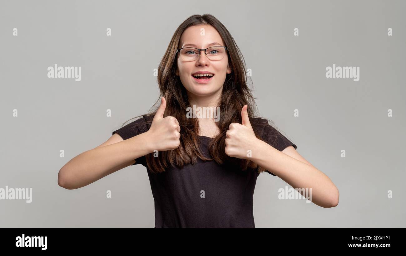 like gesture perfect choice amused woman thumbs up Stock Photo - Alamy