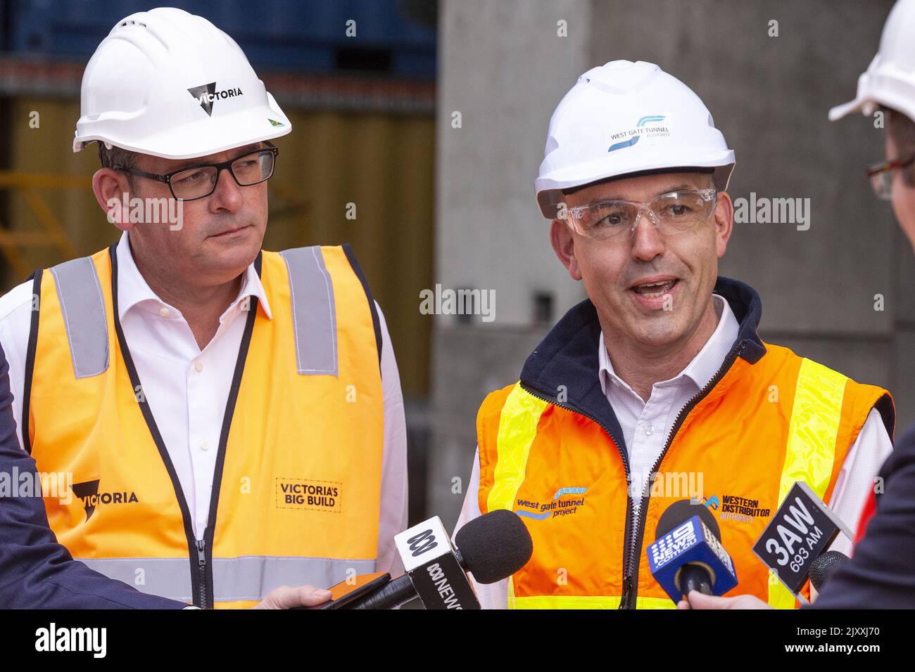 CEO of the West Gate Tunnel project Peter Sammon (right) speaks to ...