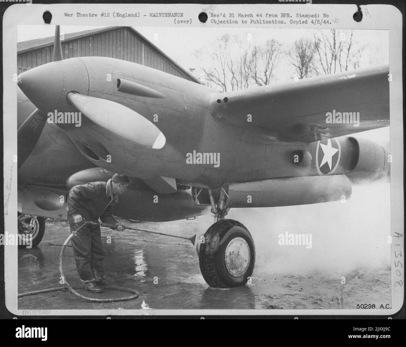 P-38's get a live steam bath to cleanse protective grease from exposed ...