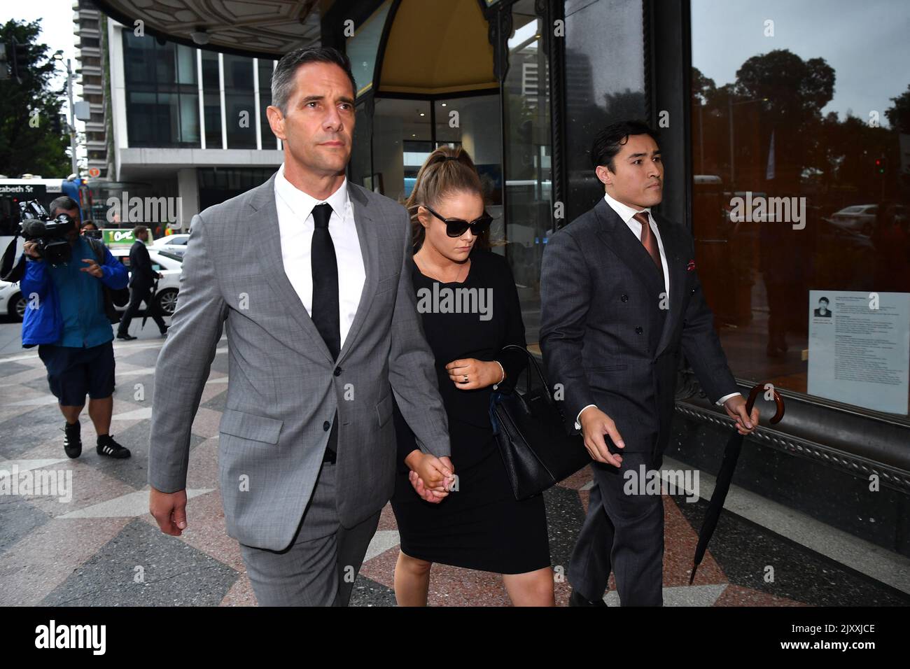 Roman Quaedvlieg (left) and Sarah Jane Chisholm Rogers (centre) arrive ...