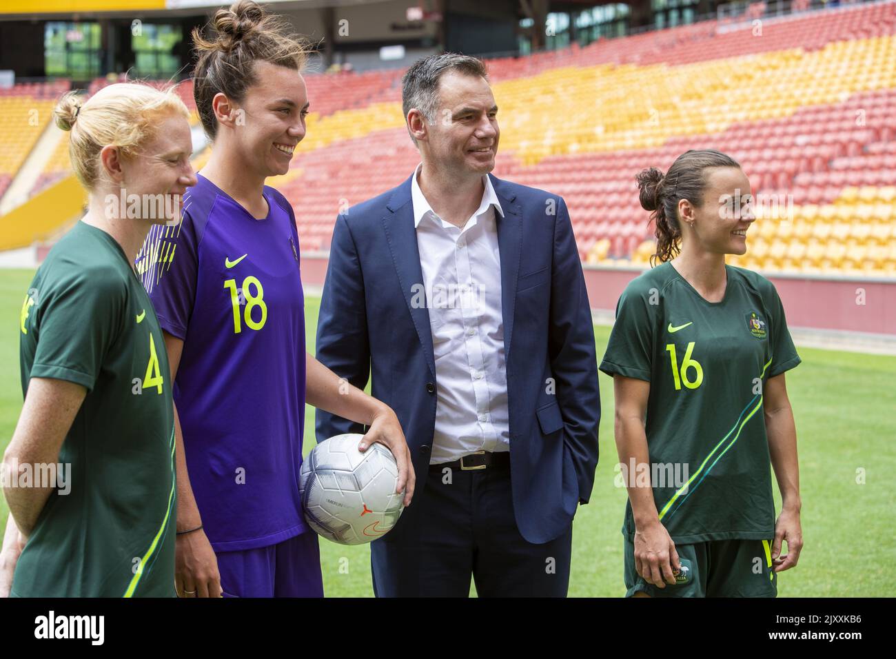 Ante Milicic poses for a portrait with Matilda players (L-R) Clare ...