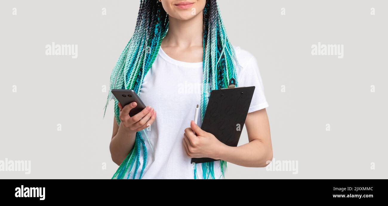 millennial generation woman blue hair braids work Stock Photo - Alamy