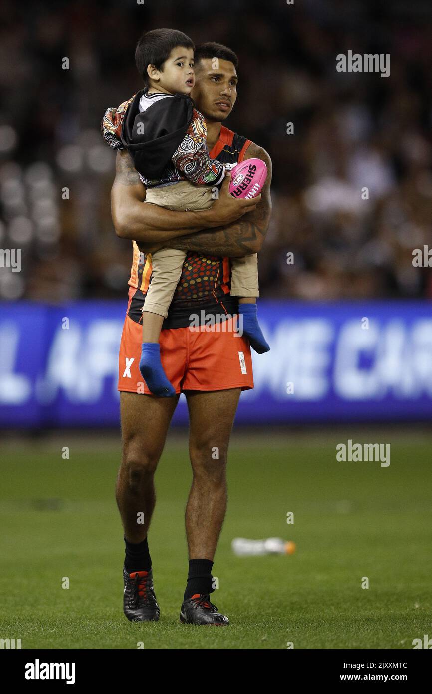 Tim Kelly of team Deadly is seen with his son during the AFLX grand ...