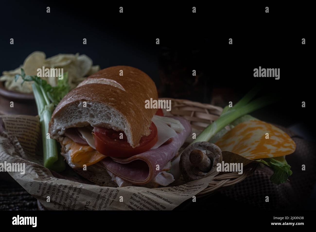 Ham and cheese submarine hoagie sandwich with potato chips Stock Photo ...