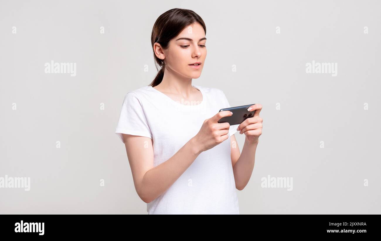 online entertainment mobile app woman smartphone Stock Photo - Alamy