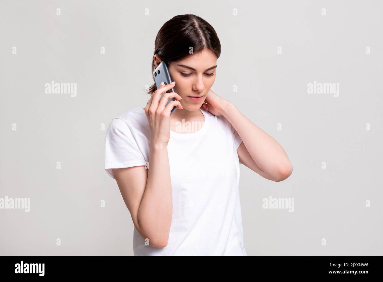 confused woman portrait phone call focused lady Stock Photo - Alamy