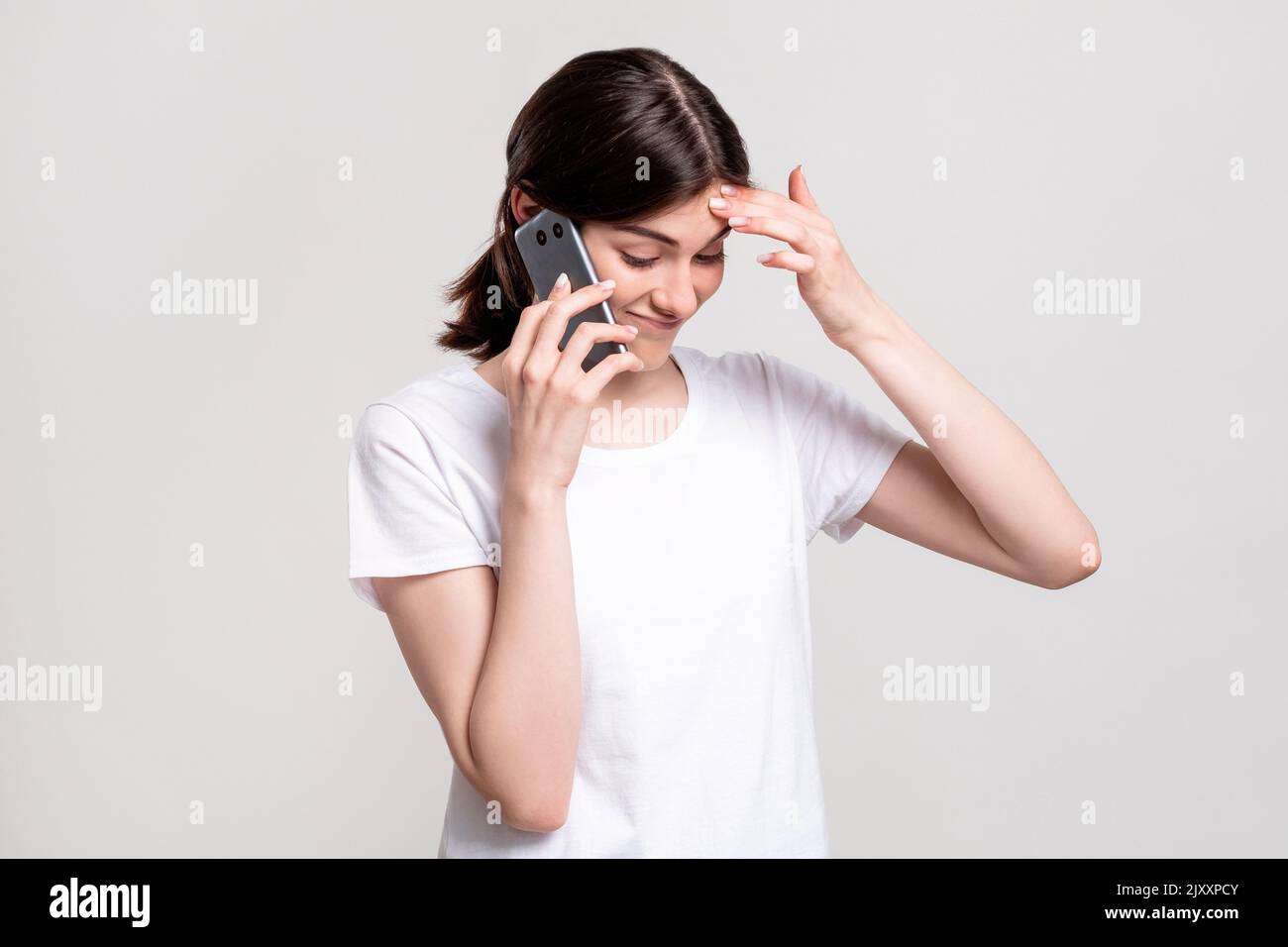confused woman portrait phone call annoying spam Stock Photo - Alamy