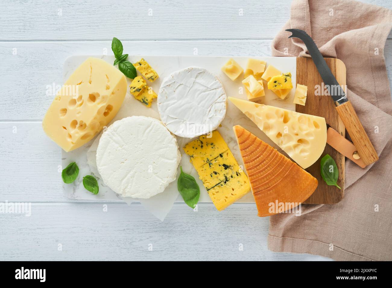 Set or assortment cheeses. Maasdam, smoked cheese, camembert, blue ...