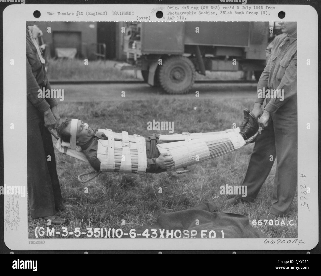 A Semi-Rigid Litter That Is Wrapped Splint-Like Around A Wounded Airman ...