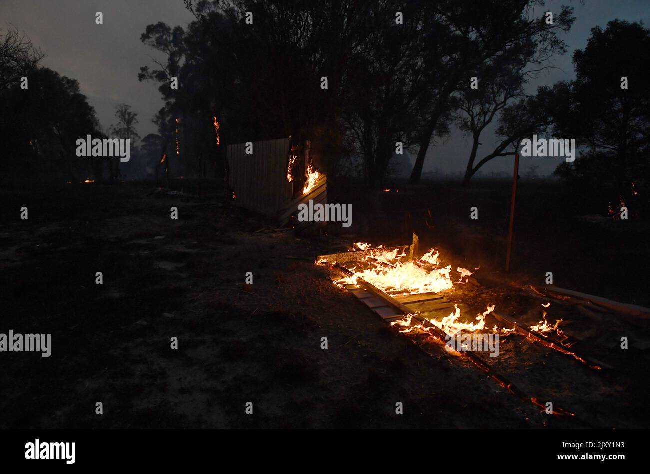 Fire is seen on a structure near Bunyip in Victoria, Sunday, March 3 ...