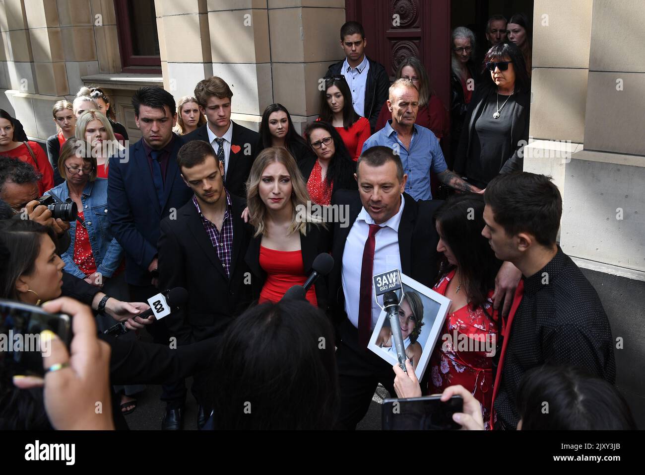 Boyd Unwin (centre), father of victim Katie Haley, speaks to media with ...