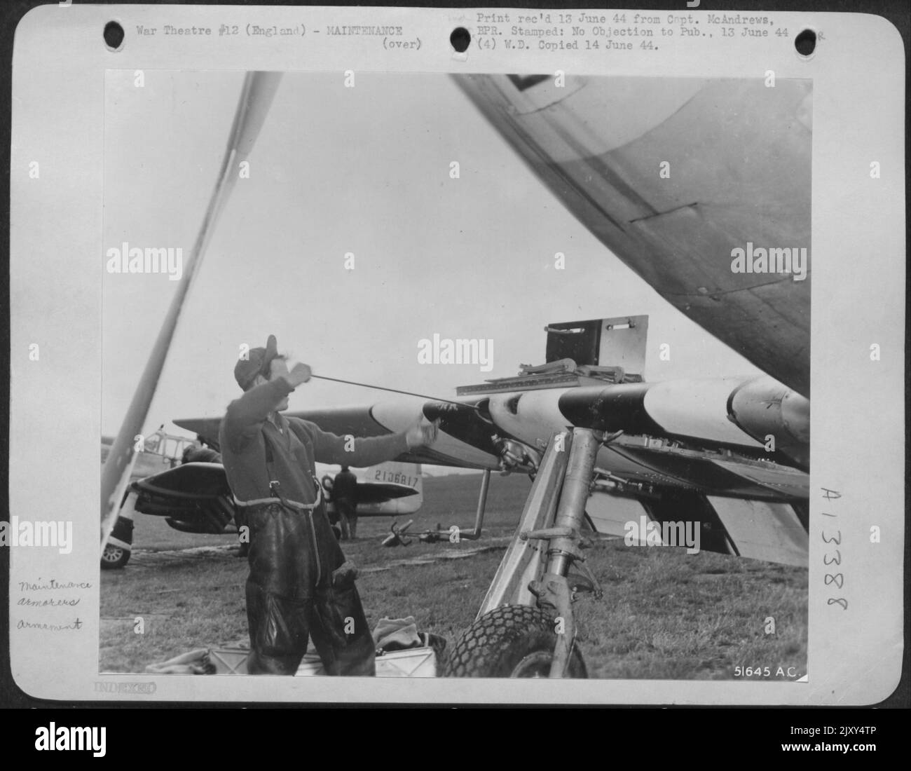 An Eighth Fighter Command North American P-51 Mustang armorer cleans ...