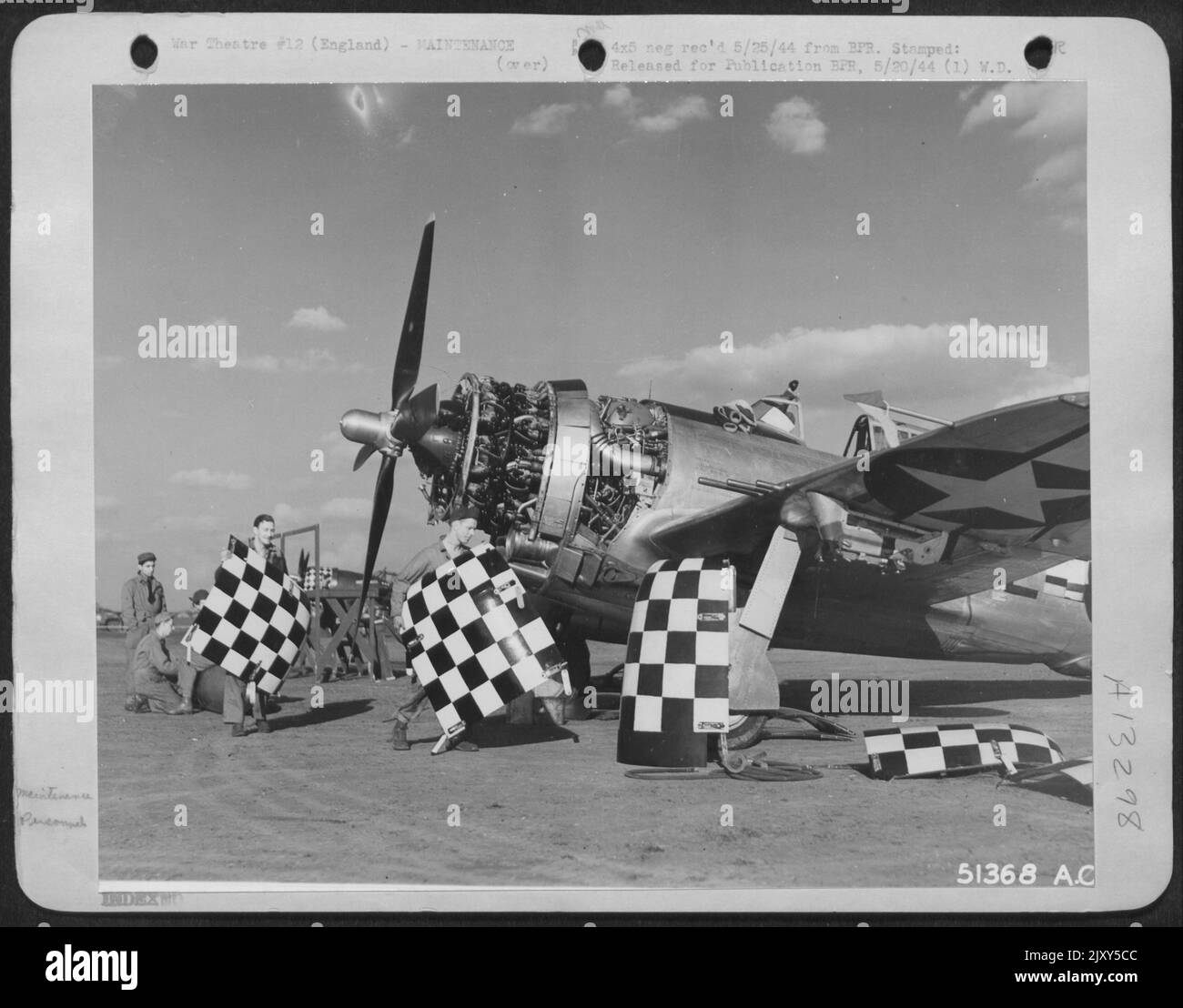 P-47 GETS NEW DRESS. .. Left to right: S/Sgt. Jim Sterner of Seattle ...