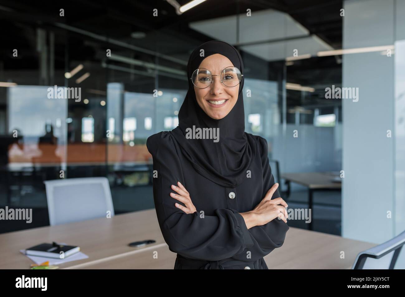 Portrait of muslim woman in hijab at work in office, business woman ...