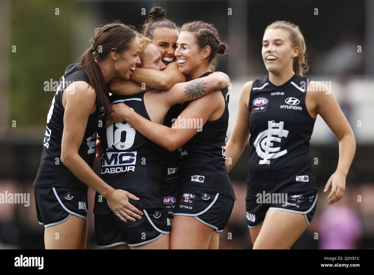Tilly Lucas-Rodd of the Blues (second from left) celebrates a goal ...