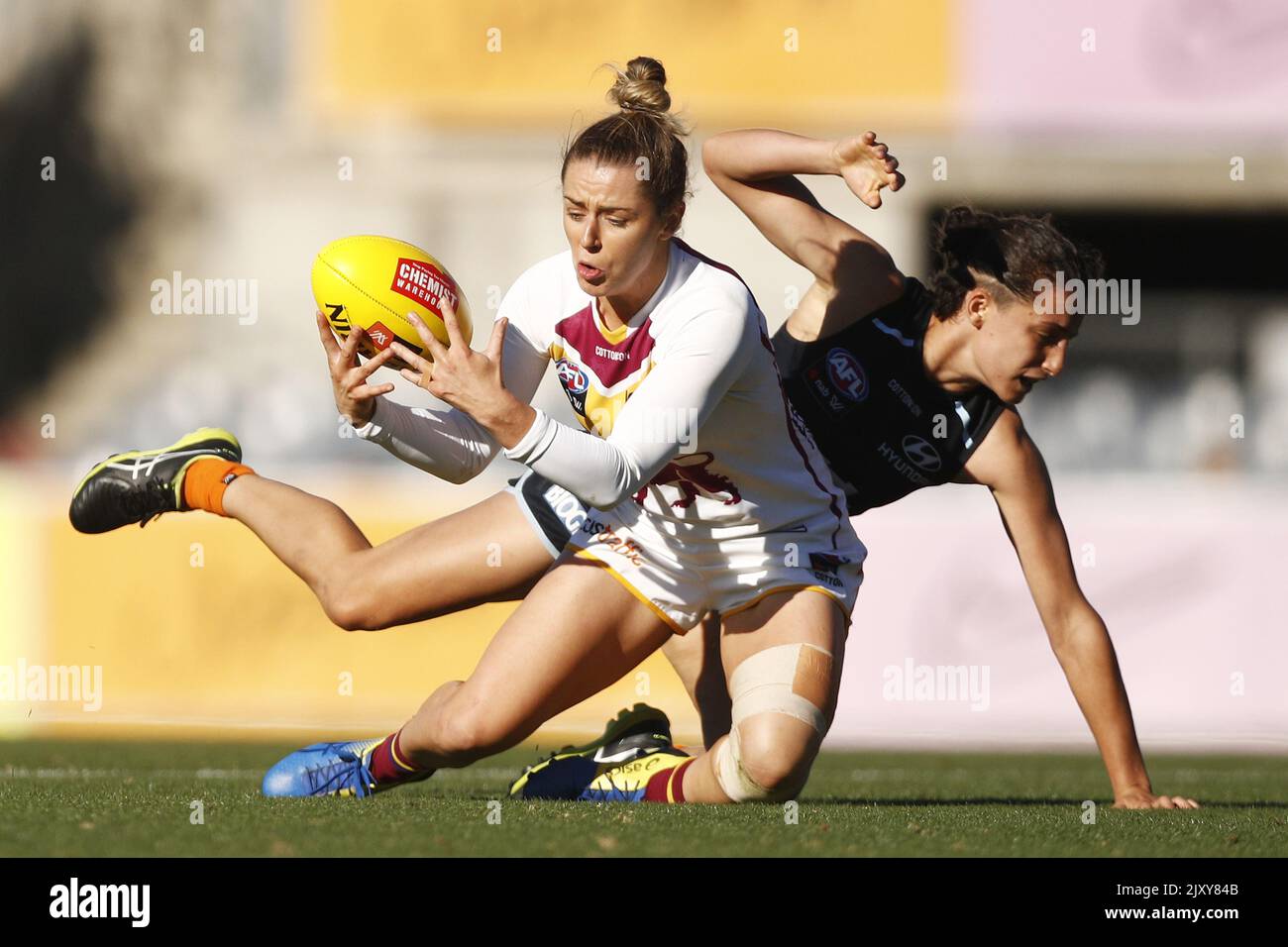 Jessica Wuetschner of the Lions and Gabriella Pound of the Blues ...