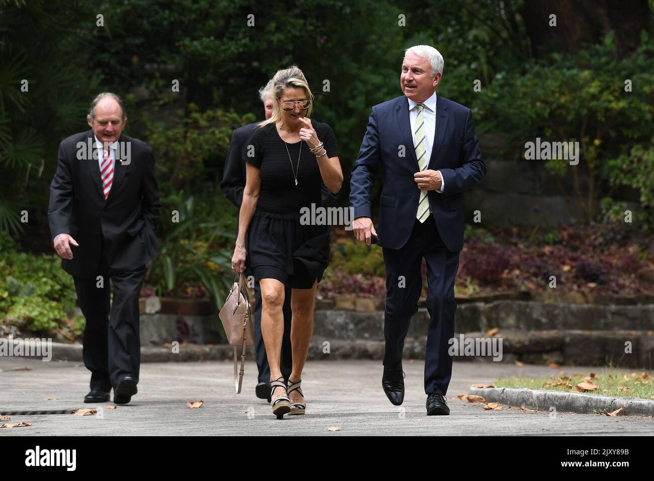 John Hartigan (right) arrives at the funeral of John Kennerley, husband ...