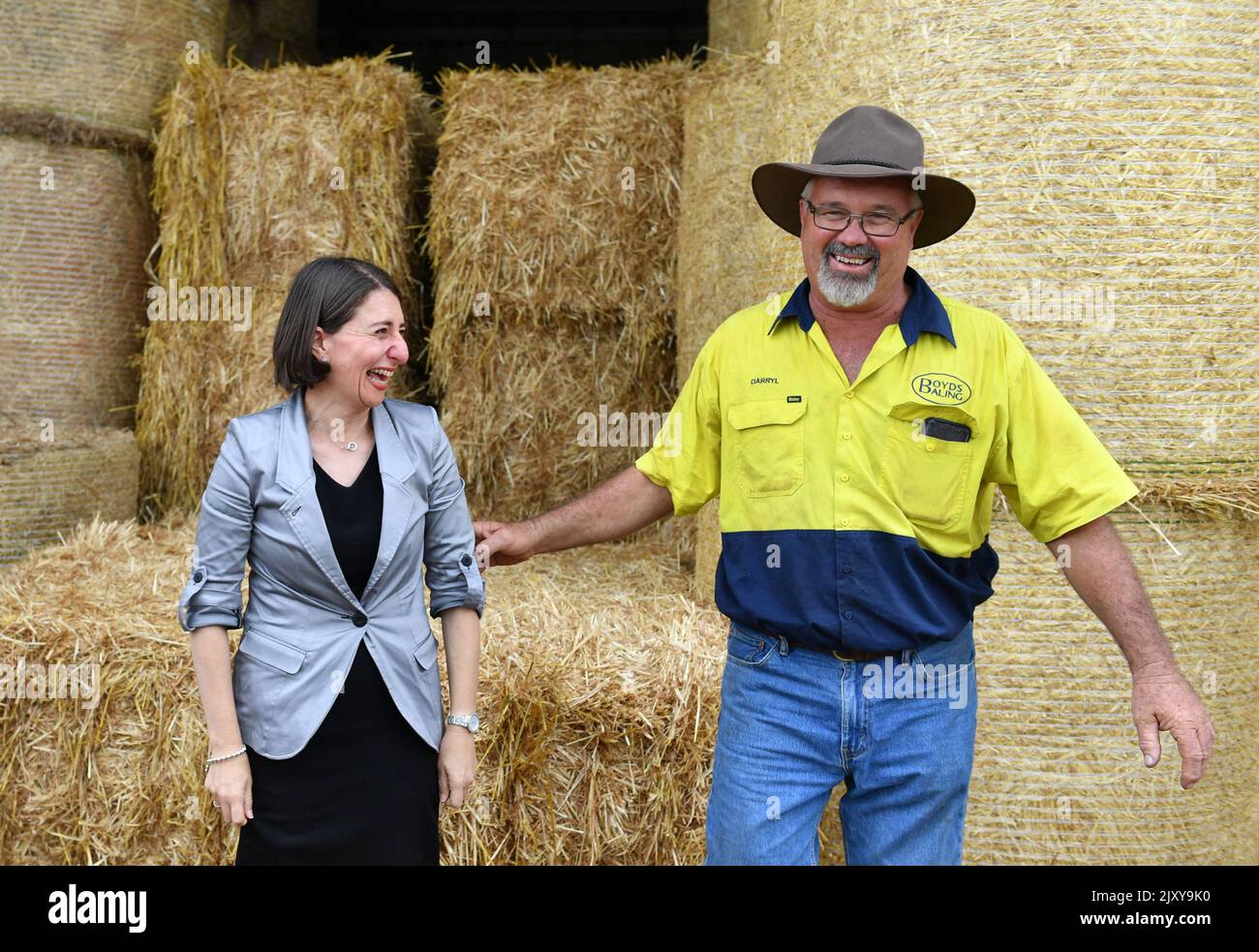 NSW Premier Gladys Berejiklian and farmer Daryl Boyd at a hay farm ...