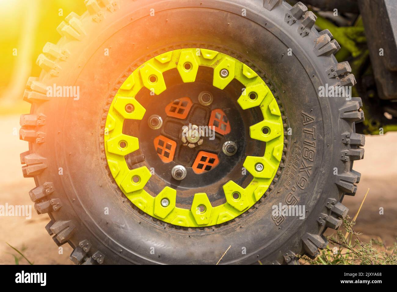 Close-up of the ATV wheel on sandy ground Stock Photo - Alamy