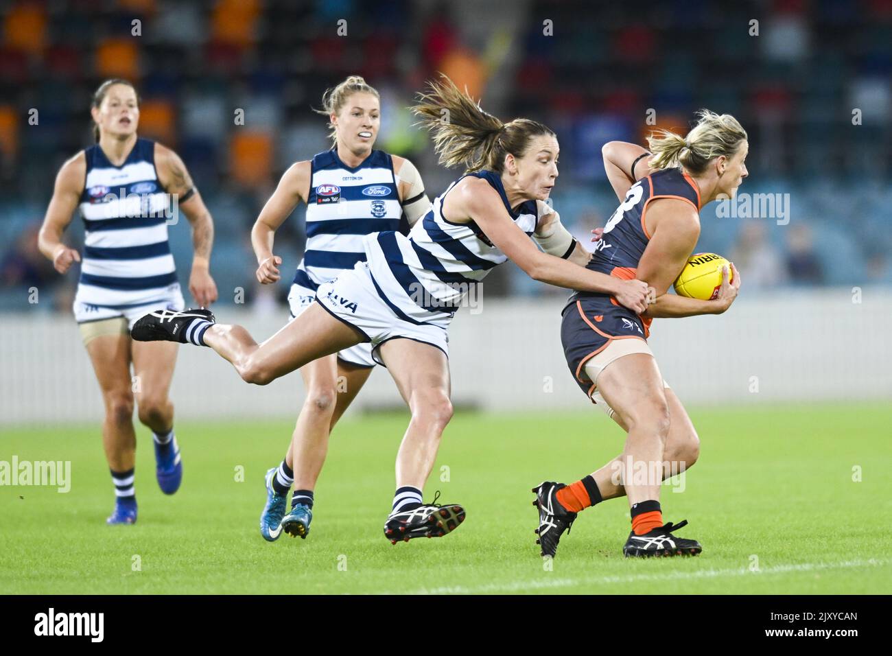 Cora Staunton of the Giants is tackled by Madaleine McMahon of the Cats ...