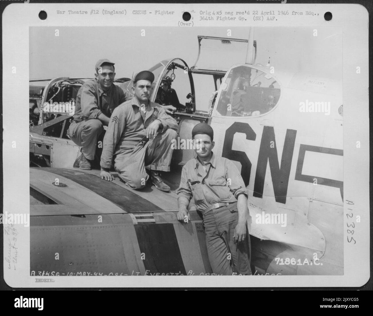 The Ground Crew Of Lt. Everett'S North American P-51 Pause From Their ...