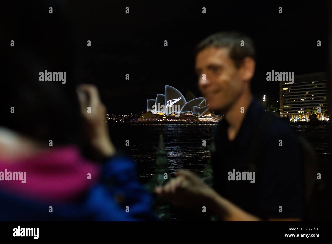 The Silver Fern of New Zealand is seen projected onto the sails of the ...