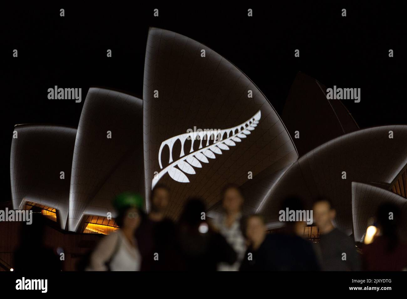 The Silver Fern of New Zealand is seen projected onto the sails of the ...