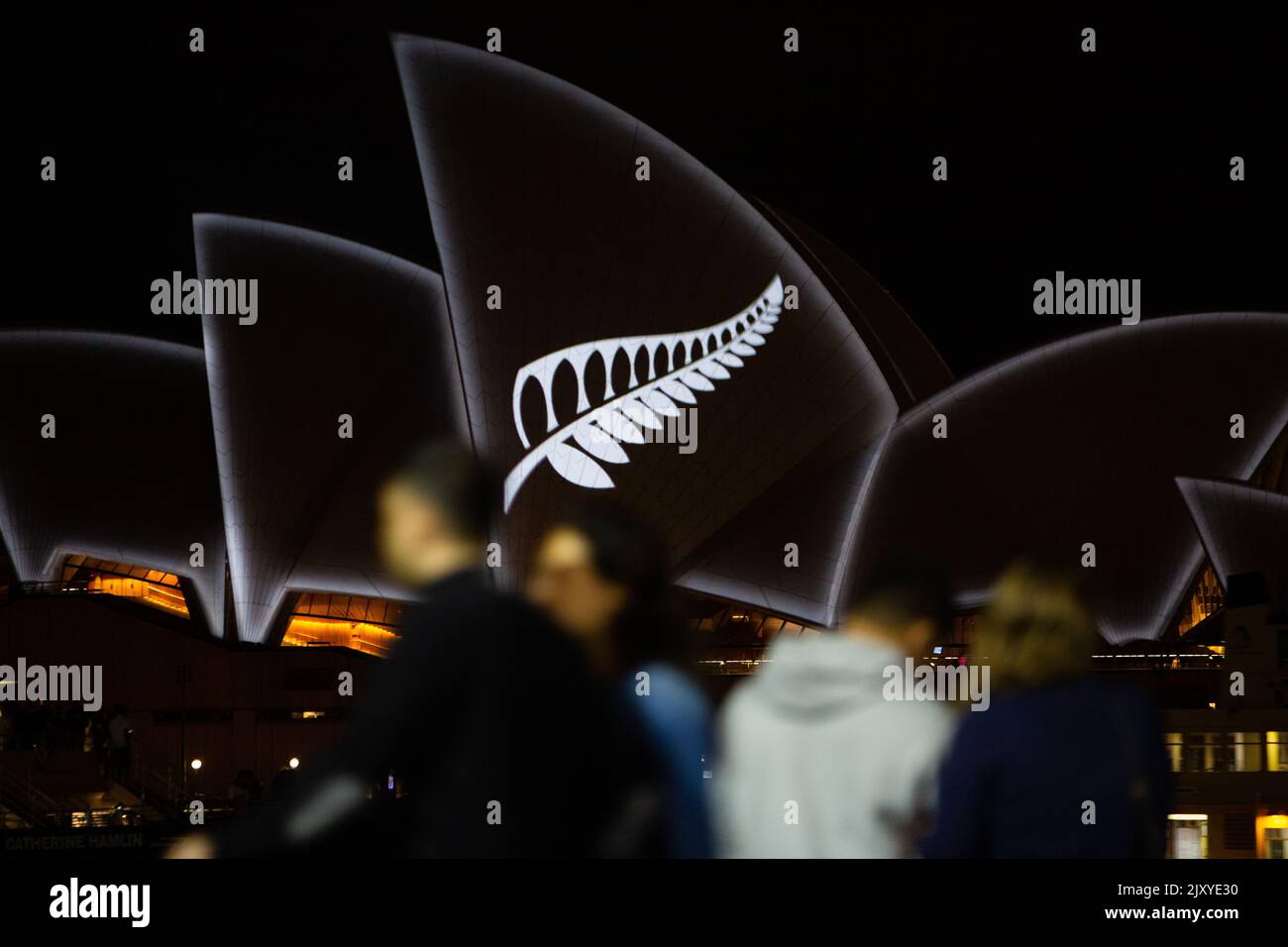 The Silver Fern of New Zealand is seen projected onto the sails of the ...