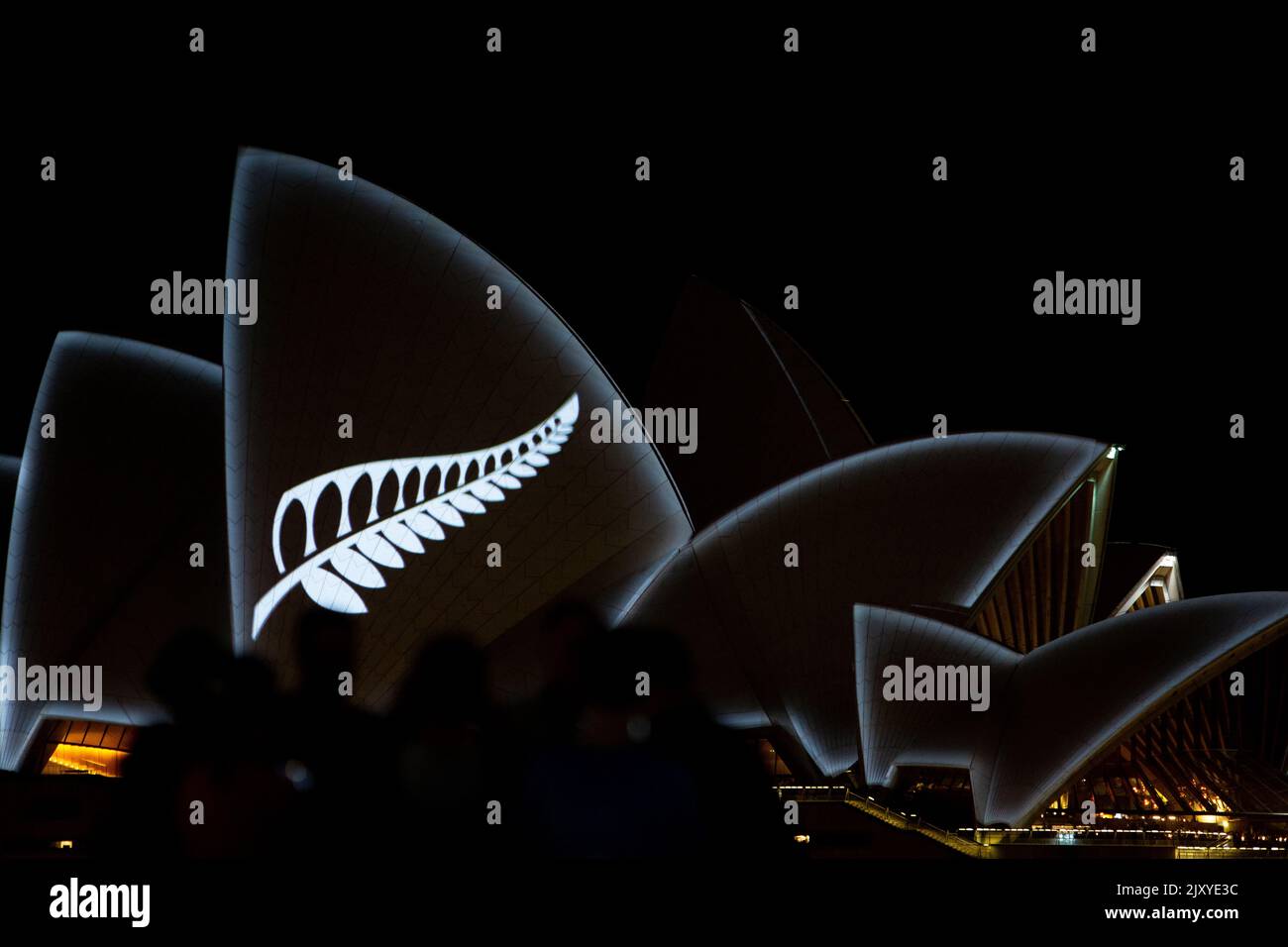 The Silver Fern of New Zealand is seen projected onto the sails of the ...