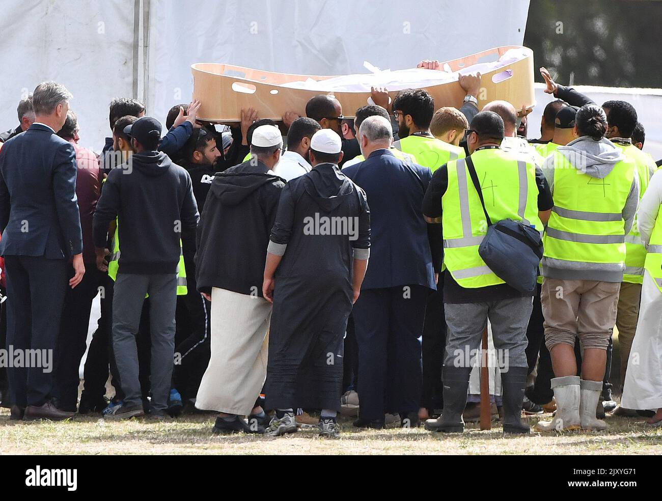 Mourners hold the caskets of father and son, Khaled and Hamza Mustafa ...