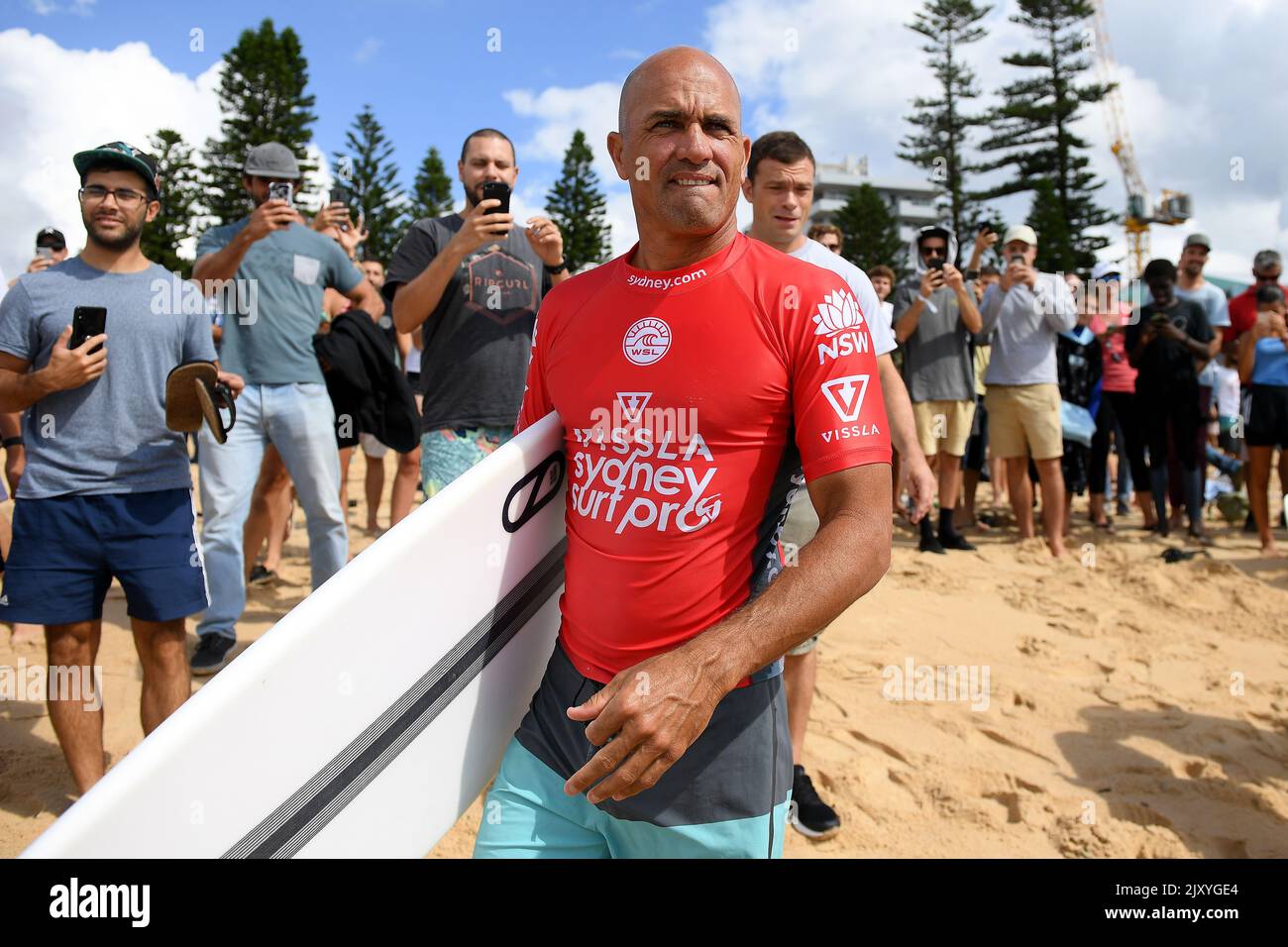 US surfer Kelly Slater walks down to the water ahead of his heat in the Sydney Surf Pro, at ...