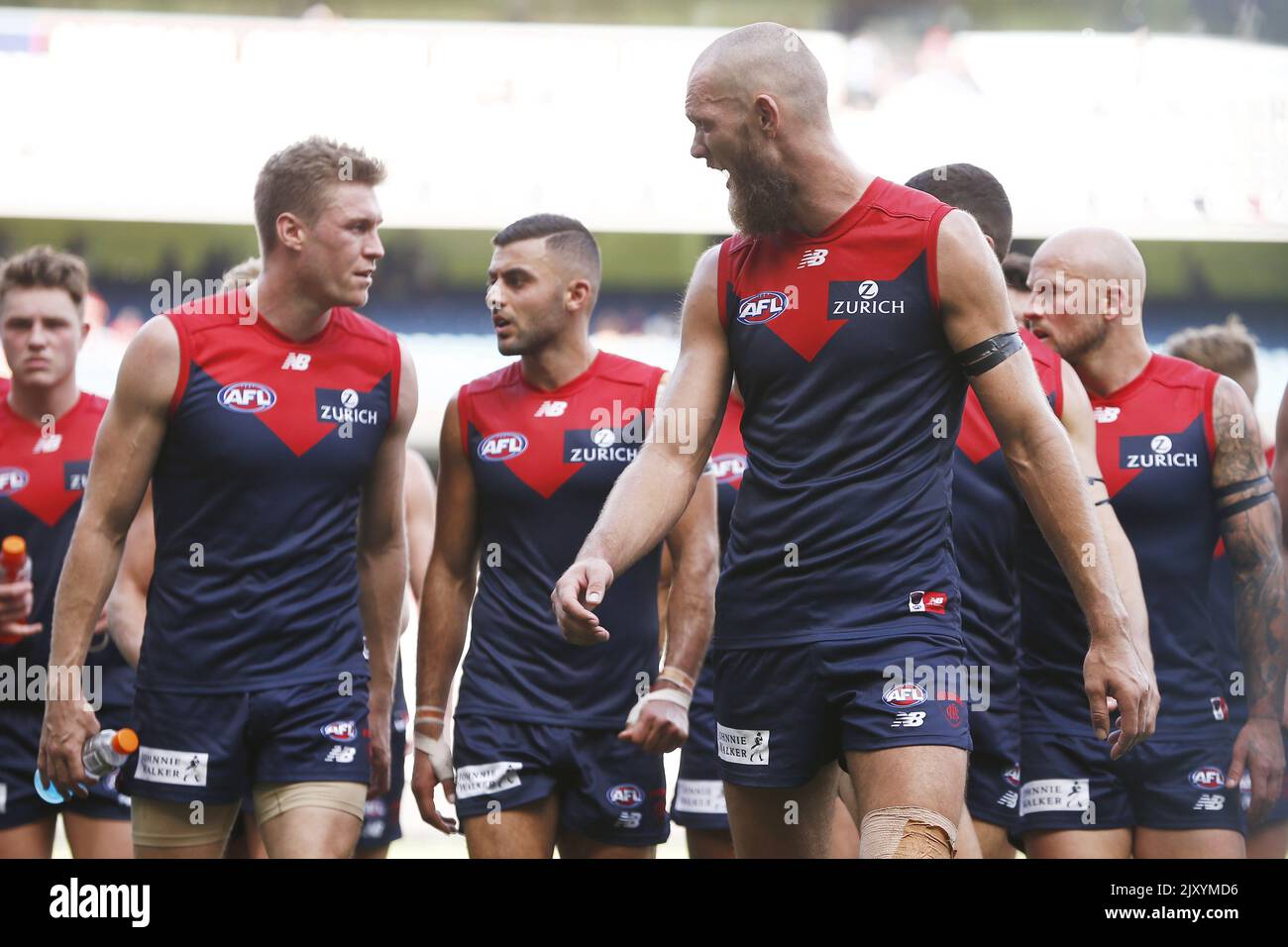 Demons players leave the ground looking dejected after the Round 1 AFL ...