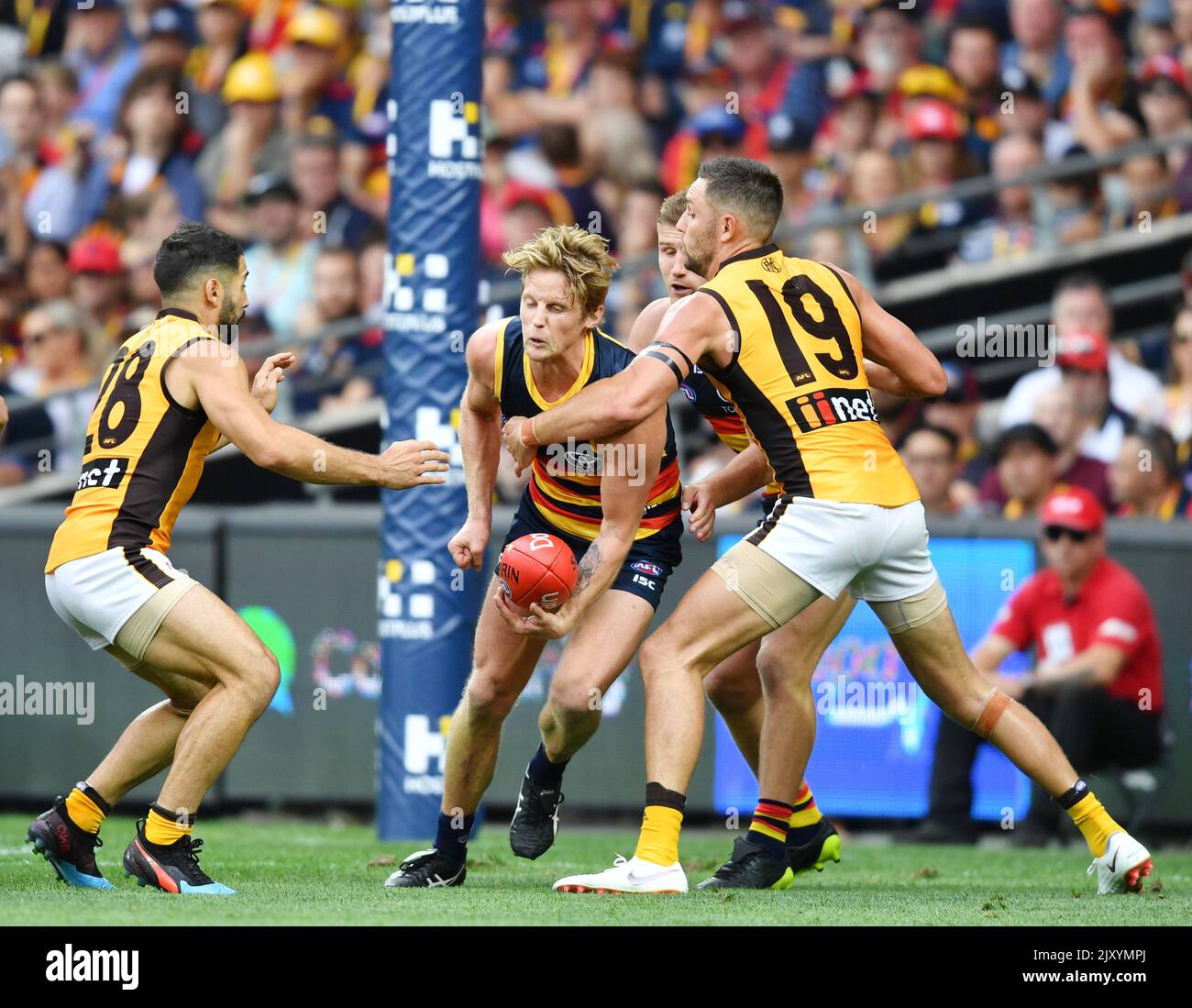 Rory Sloane of the Crows is tackled by Jack Gunston of the Hawks (R) during the Round 1 AFL ...