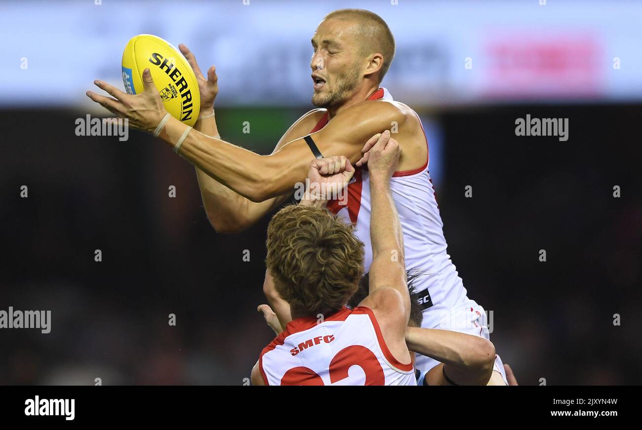 Sam Reid of the Swans (right) is seen in action during the Round 1 AFL ...
