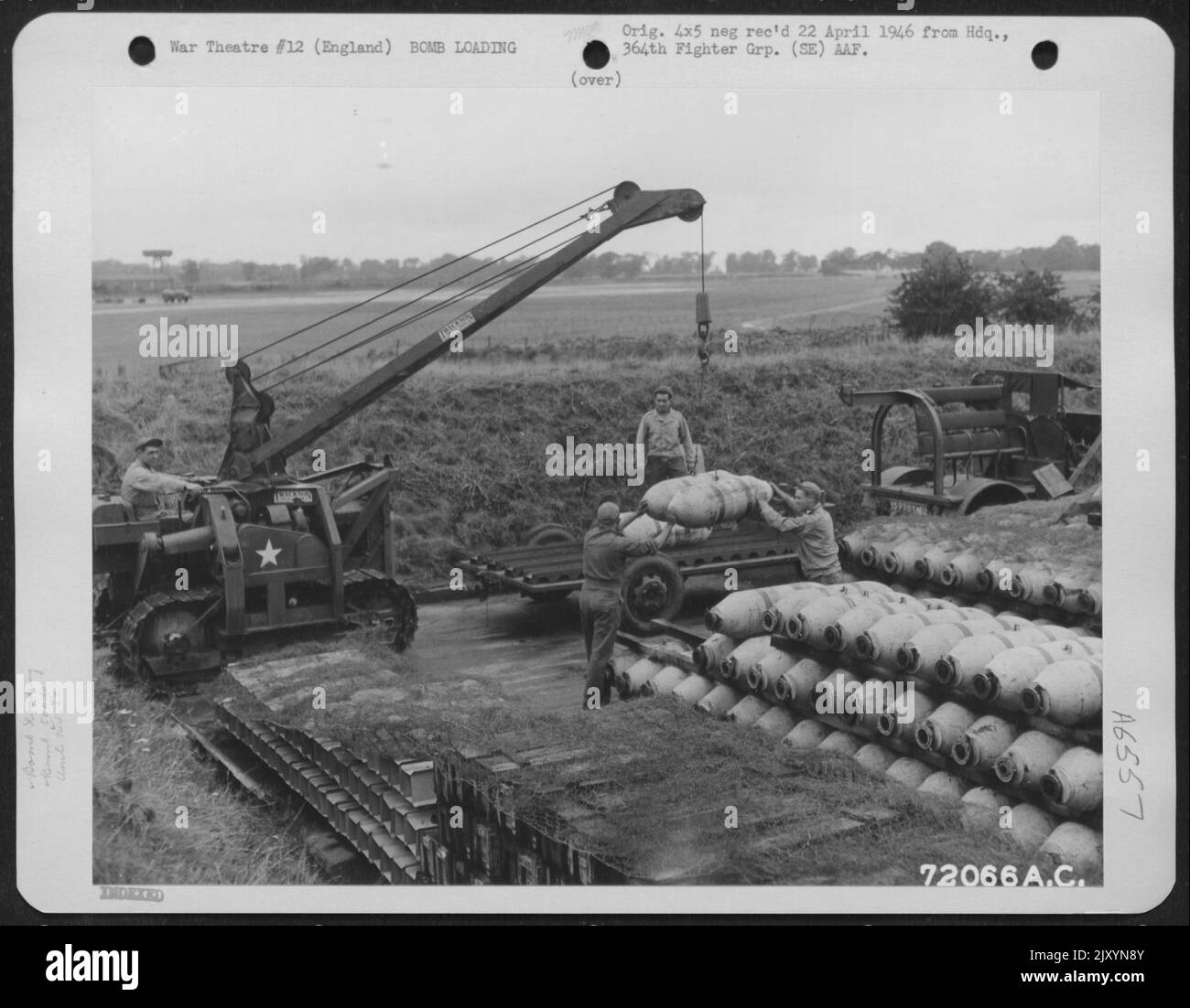 Five Hundred Pound Bombs Are Hoisted Onto A Trailer From A Dump Of The ...