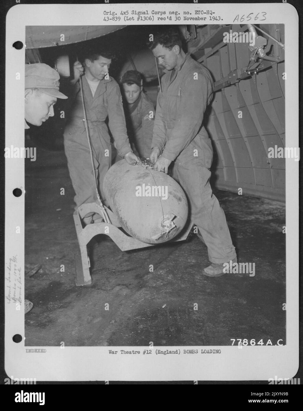 Members Of An 8Th Air Force Heavy Bomb Group Crank A Bomb Into Position ...