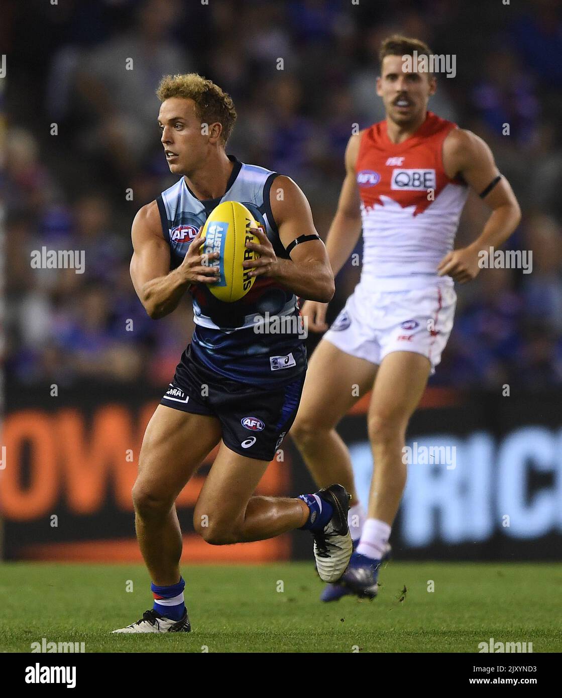 Mitch Wallis of the Bulldogs (left) is seen in action during the Round ...