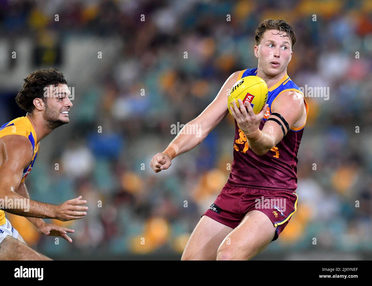 Alex Witherden (right) of the Lions in action during the Round 1 AFL ...