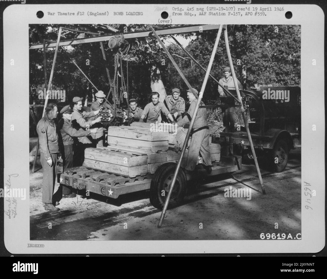 Ordnance Crew Load Bombs On A Bomb Trailer In Preparation For A Mission ...