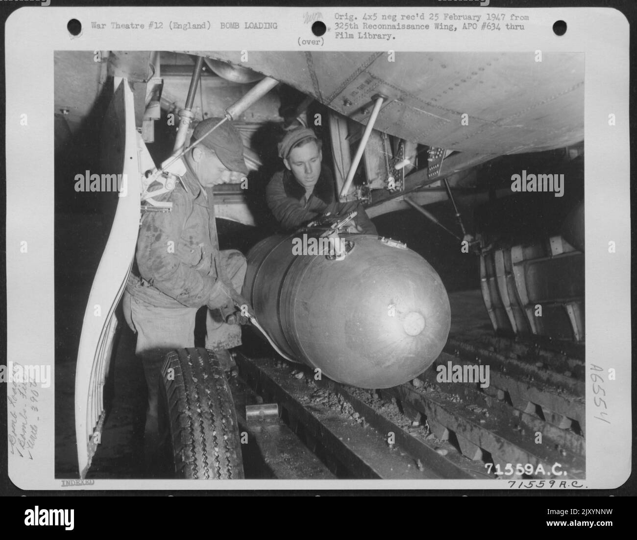 Armorers Of The 390Th Bomb Group Load Fire Bombs Into The Bomb Bay Of A ...